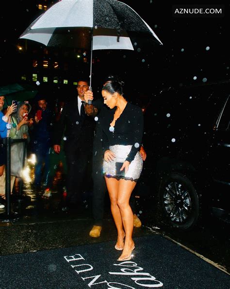 Kim Kardashian Nearly Busts Out Of Her Sexy Black Button Up Top As She