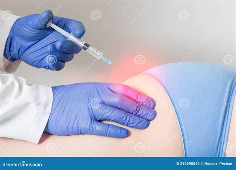 The Doctor Makes The Procedure Of Injection Blockade Into The Piriformis Muscle Of The