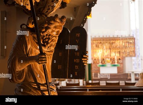 Statue Of Moses With The Ten Commandments And Winged Altar In The