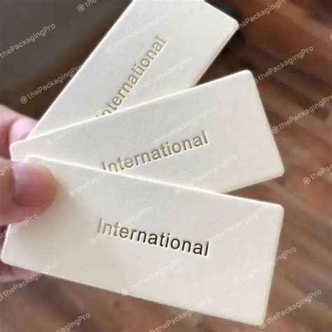 Custom Hang Tags With Recycled Paperglossy Finishand Embossed Designs