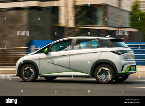 Byd Dolphin Small Electric Hatchback Car Being Driven On The Road In Putuo District Shanghai