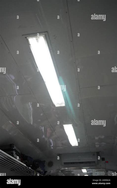 The Lights In An Economy Class Train In Indonesia Are On In The Morning