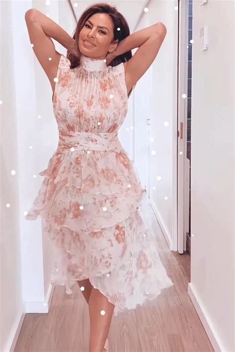 Eva Mendes Shows Off Her Holiday Style In A Flowy Floral Dress Amore