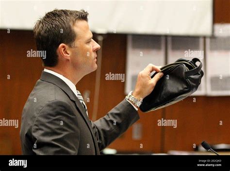 Deputy District Attorney David Walgren Holds A Black Bag As He