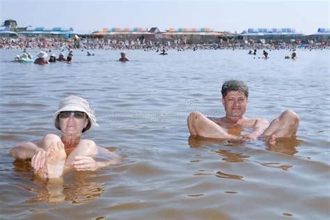 Vacationers Undergo Treatment By Swimming In The Lake And Sunbathing In