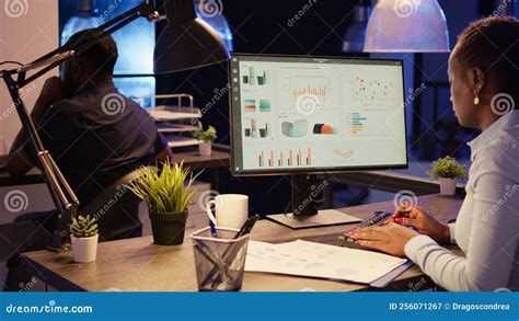 Office Worker Analyzing Research Data On Computer Network Stock Image