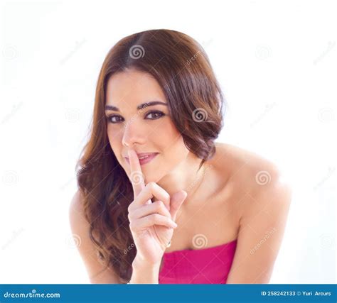 This Is Between You And Me Portrait Of An Attractive Young Woman Gesturing With Her Finger On