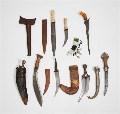 Lot A Group Of Seven Daggers In Scabbards