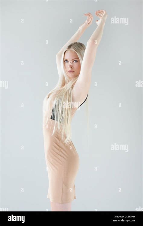 Stretching Her Beauty Portrait Of An Attractive Young Female Wearing A