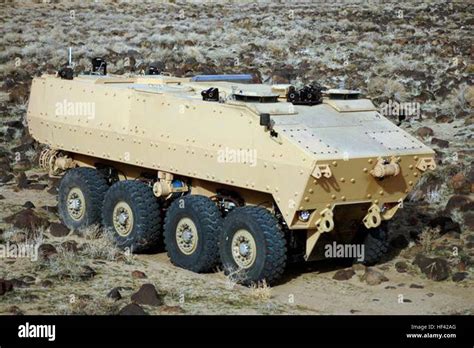 A Marine Demonstrates A Personnel Carrier During Military Exercises