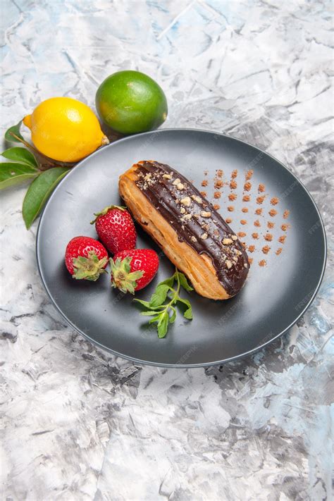 Free Photo Top View Yummy Choco Eclairs With Strawberries On Light