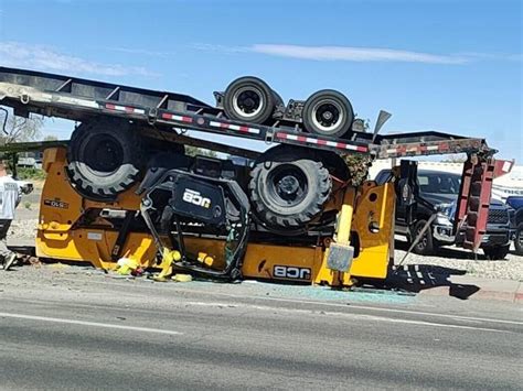 Trailer Carrying Construction Equipment Flips Upside Down In Cedar City