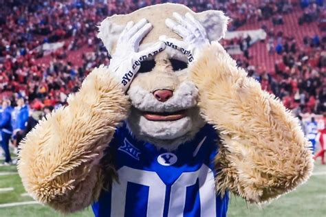 Byu Mascot Cosmo Cougar Makes An Incredible Jump Over An Equipment Cart