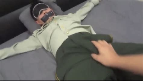 A Armed Police Officer Bound To A Bed