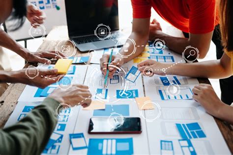 Ux Developer And Ui Designer Brainstorming About Mobile App Interface