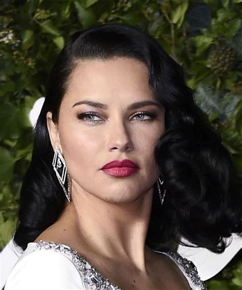 Adriana Lima Medium Curly Black Hairstyle With Side Swept Bangs