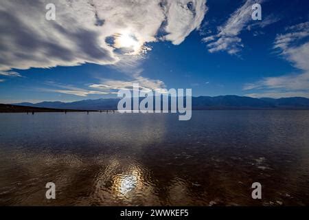 People Wade In Lake Manly An Ephemeral Lake In Badwater Basin Saturday March 7 2026 In Death