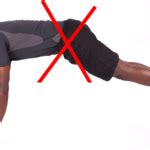Sporty Man Doing Side Plank Exercise On Yoga Mat High Quality Free