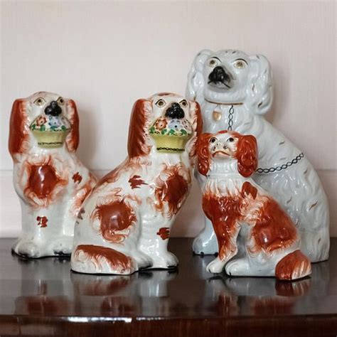 Group Of Four Staffordshire Flatback Dogs Sold At Auction On 19th April