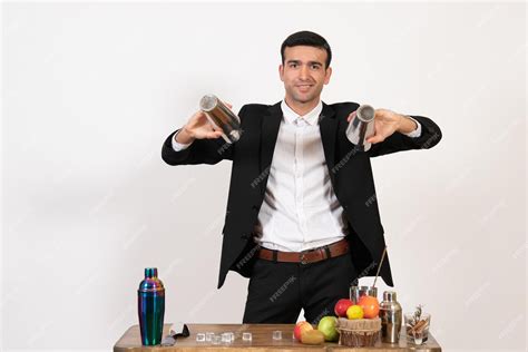 Free Photo Front View Male Bartender In Suit Working With Shakers And