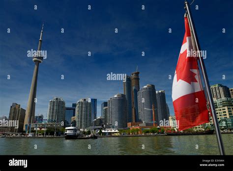 Canadian Flag On A Boat With Toronto Skyline Cn Tower And Harbourfront
