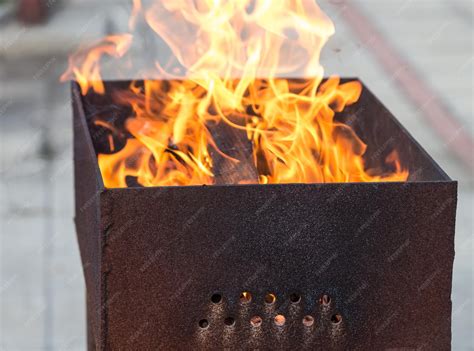 Premium Photo Burning Wood In A Brazier
