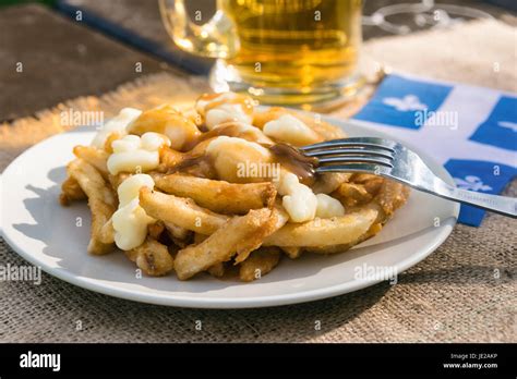 Classic Quebec Poutine With French Fries Gravy And Cheese Curds Stock