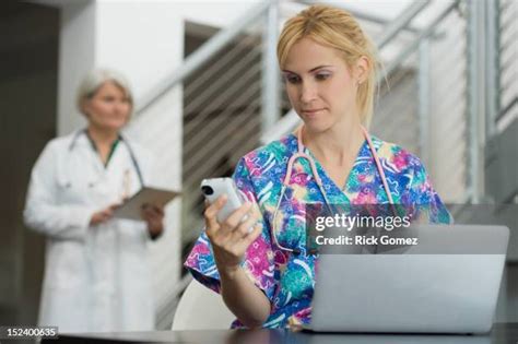 Multitasking Nurse Photos And Premium High Res Pictures Getty Images