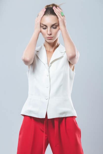 Premium Photo The Girl Is Holding Her Head The Girl Has A Headache Girl In A White Top On A