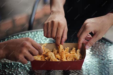 Premium Photo Friends Take And Share Snacks