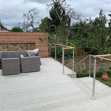 Smoked Oak Millboard Decking With Cedar Trellis South London All On