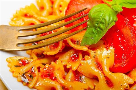 Farfalle The Italian Butterfly Pasta With Tomato Sauce Photo Background