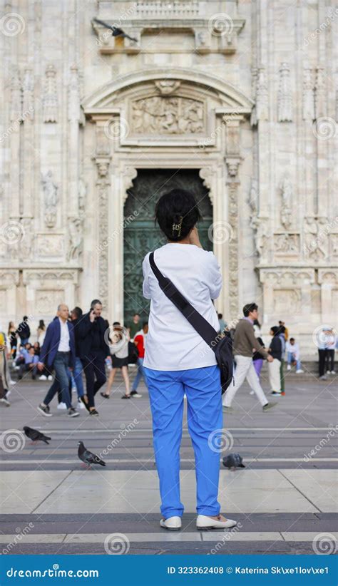 Asian Woman Taken From Behind Is Taking A Photo Of Milan Cathedral