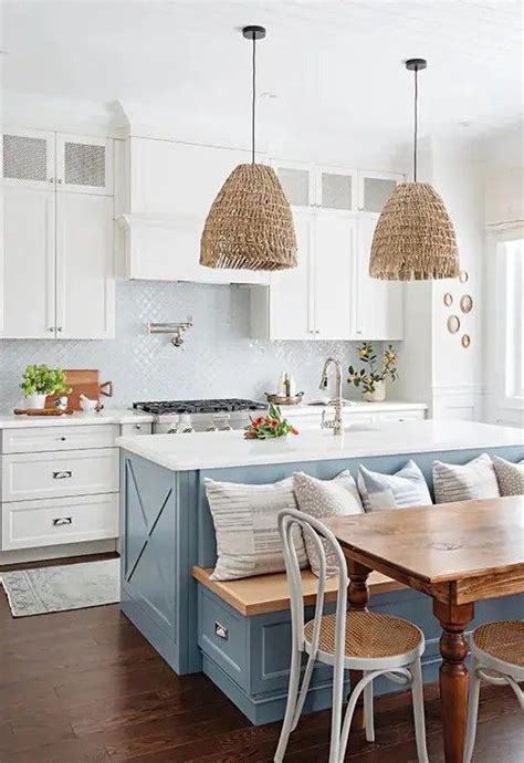 A Coastal Cottage Kitchen With White Shaker Cabinets And A Glossy Tile
