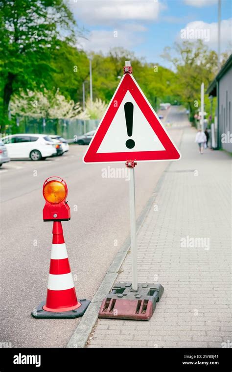 Traffic Code With Traffic Sign Danger Point On A Road Red Exclamation