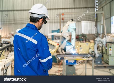500 Robotics Engineer Working On Maintenance Modern Robotic Arm Factory Warehouse Images Stock