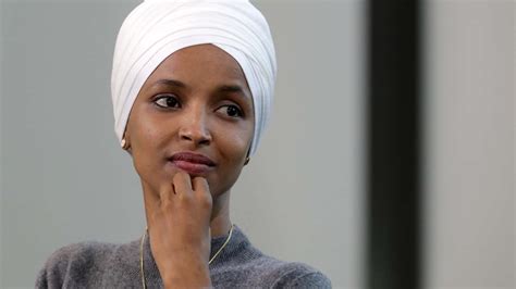 Ilhan Omar Portrait In White Hijab Serene Moment Wallpaper Background