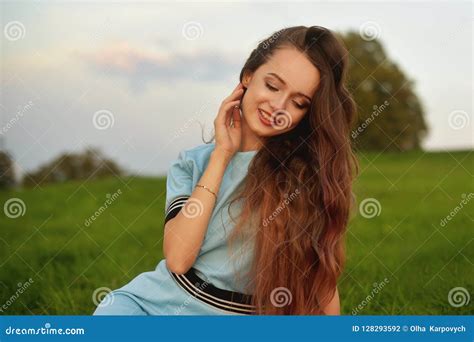 Attractive Young Woman Enjoying Her Time Outside In Sunset Park Model