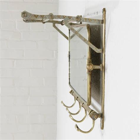 Early 20th Century Art Deco Brass Train Rack With Four Hooks And Swivel
