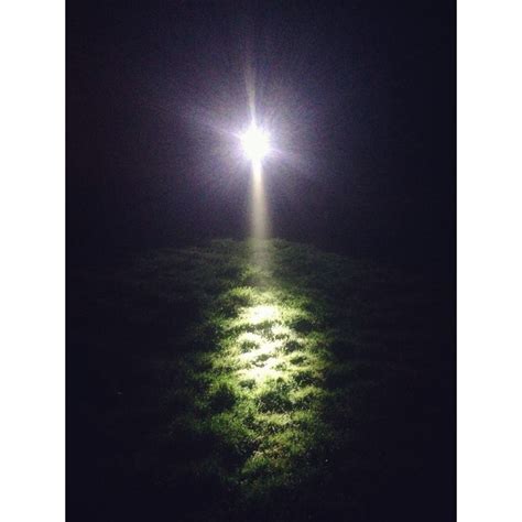 Flashlight In The Night On Grass