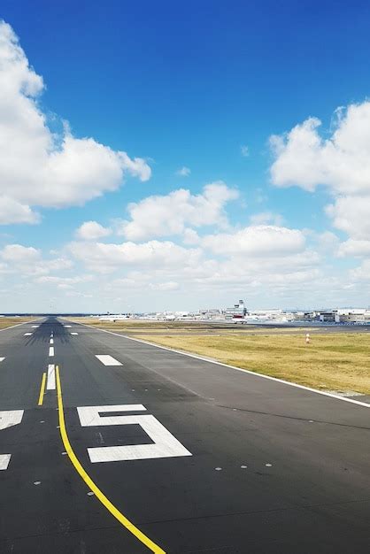 Premium Photo Empty Runway Against Sky