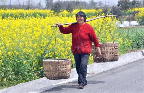 Pengzhou China Woman Carrying Wicker Baskets Editorial Stock Image