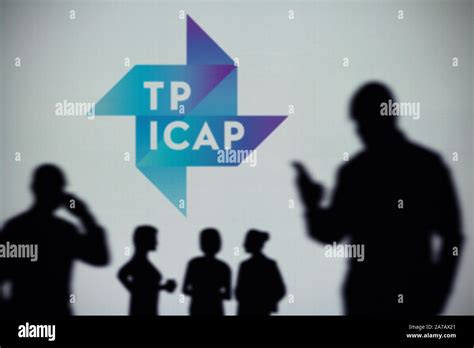 The Tp Icap Logo Is Seen On An Led Screen In The Background While A