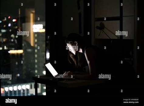 Side View Of Woman Using Notebook Computer Stock Photo Alamy