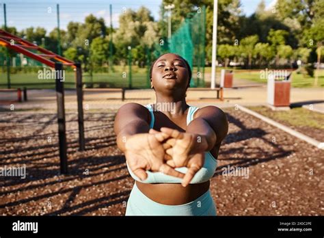 An African American Woman In Sportswear Showing Body Positivity