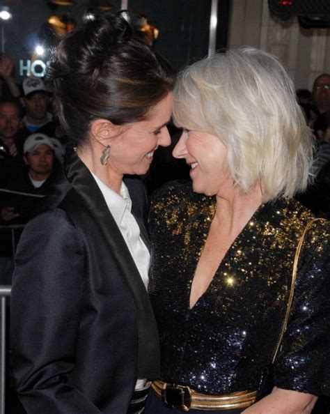 Helen Mirren With Her Silver White Hair In A Style That Touches The Collar