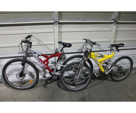 2 Bikes Red Oryx Full Suspension And Yellow Next Full Suspension