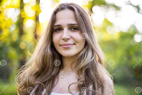 Beautiful Young Russian Girl Dressed In A White Dress Walks Through
