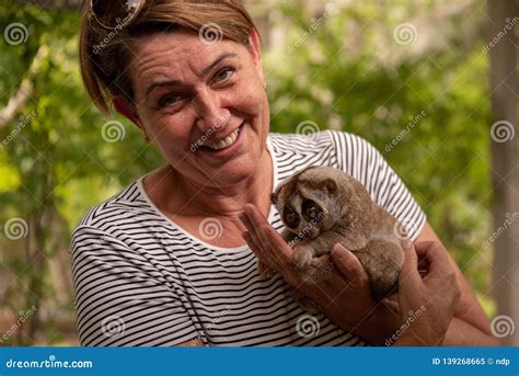 Woman Holding Slow Loris Smiles At Camera Stock Image Image Of Bangkok Nycticebus 139268665
