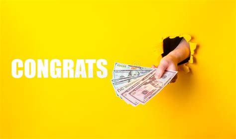 A Hand Holding A Stack Of Money With The Words Congratulations Written